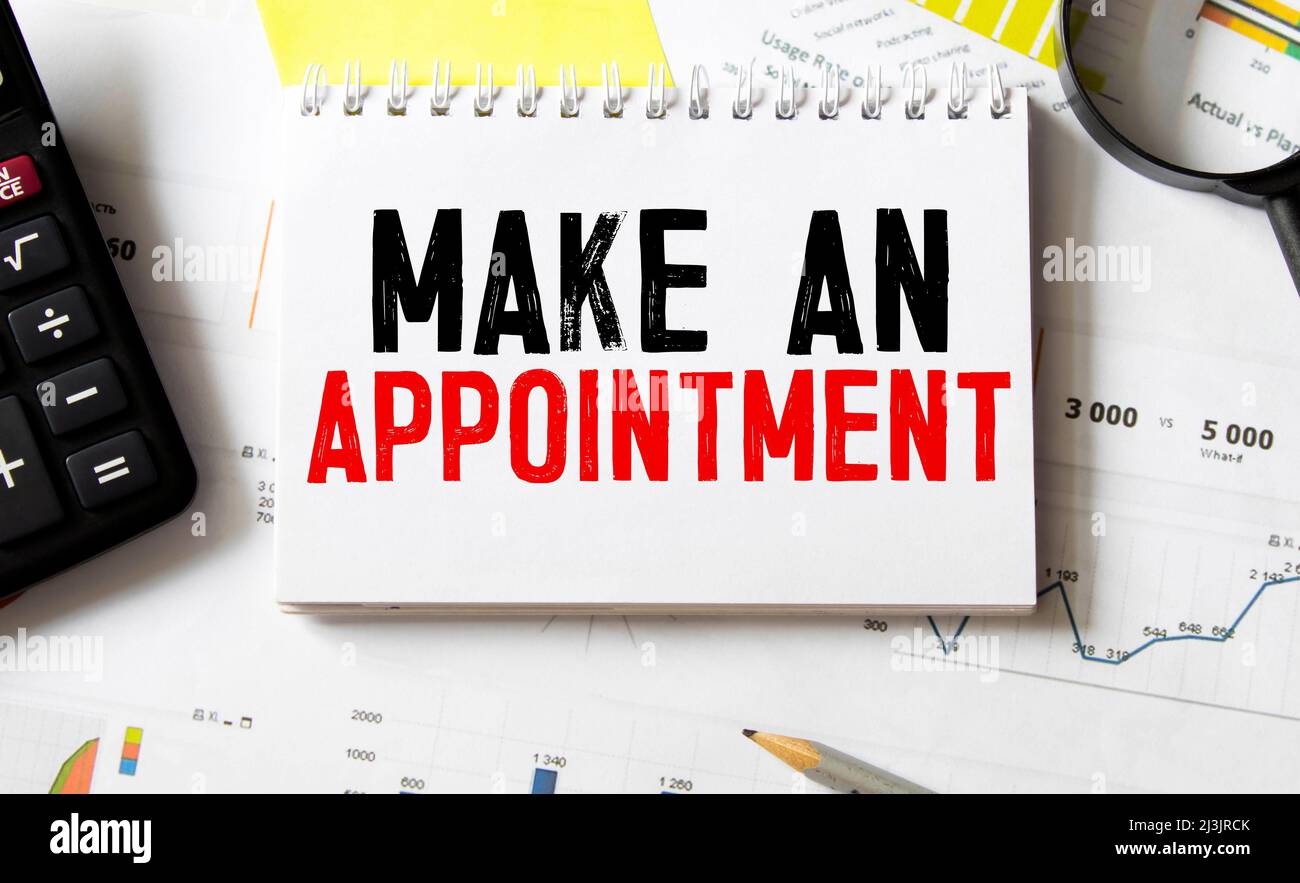 Hand with pen writing Make an appointment, concept Stock Photo - Alamy