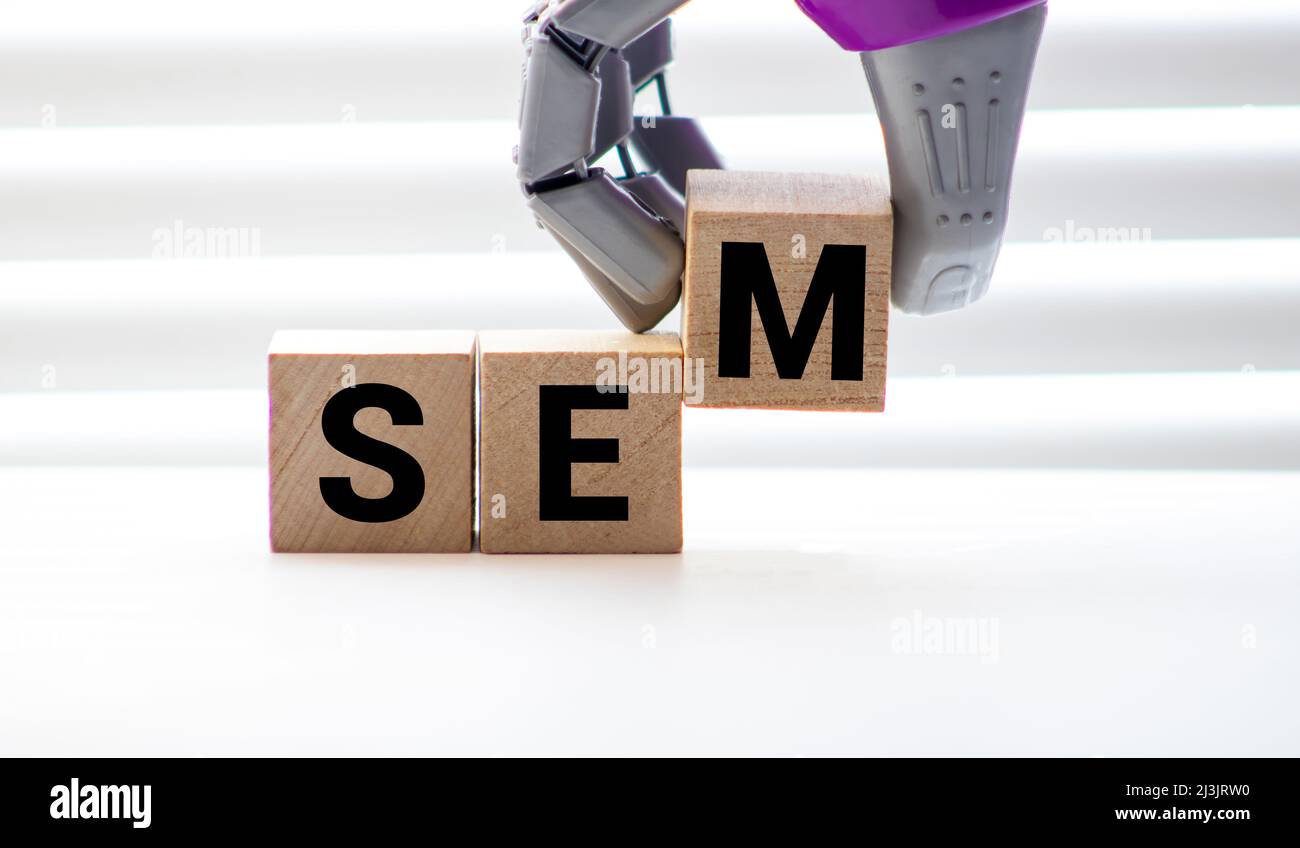 The Word SEM Formed By Wooden Blocks On A White Table Stock Photo - Alamy