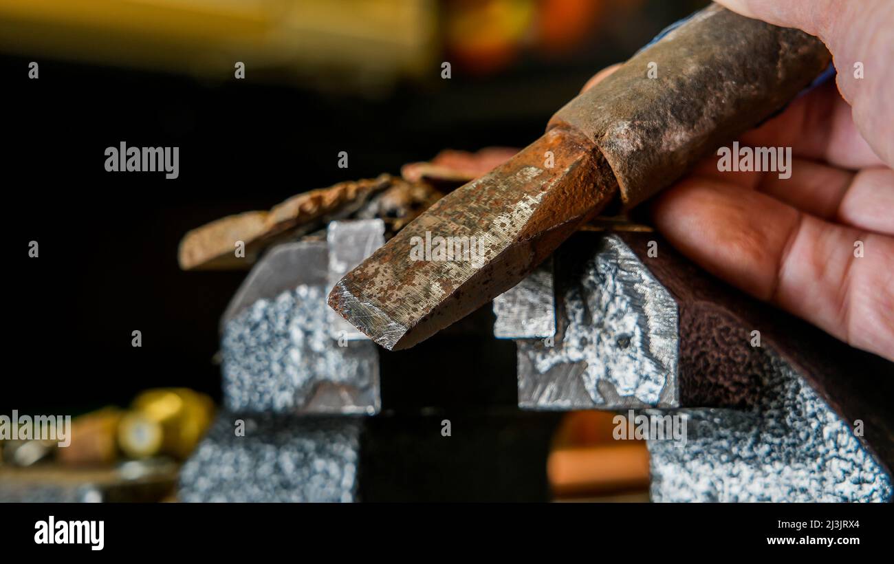 Man holding chisel hi-res stock photography and images - Alamy