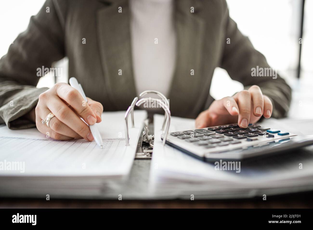 Close-up of an accountant's hand calculating at the workplace Stock ...