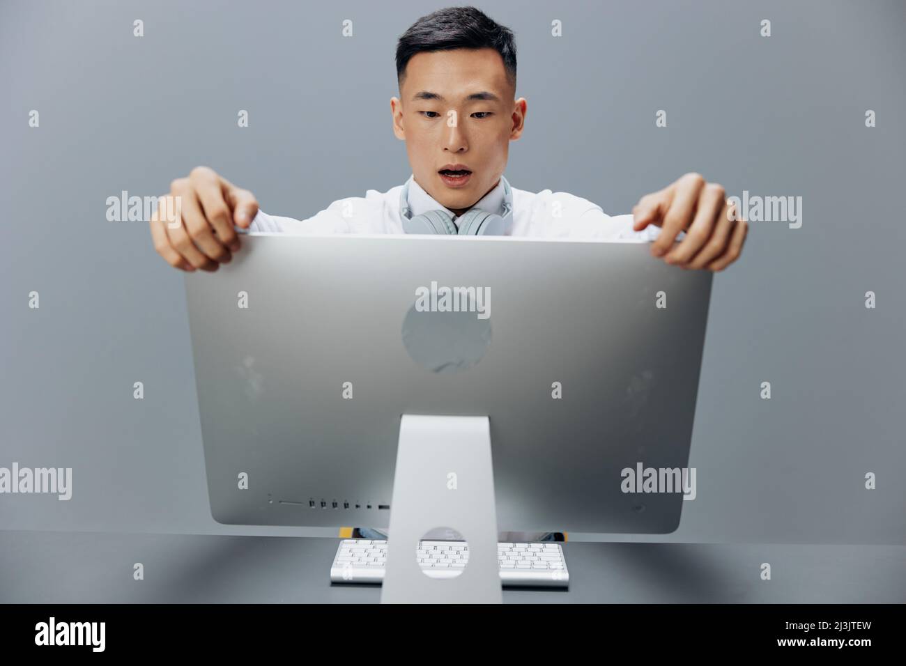 worker holding on to the monitor emotions office technologies Stock ...