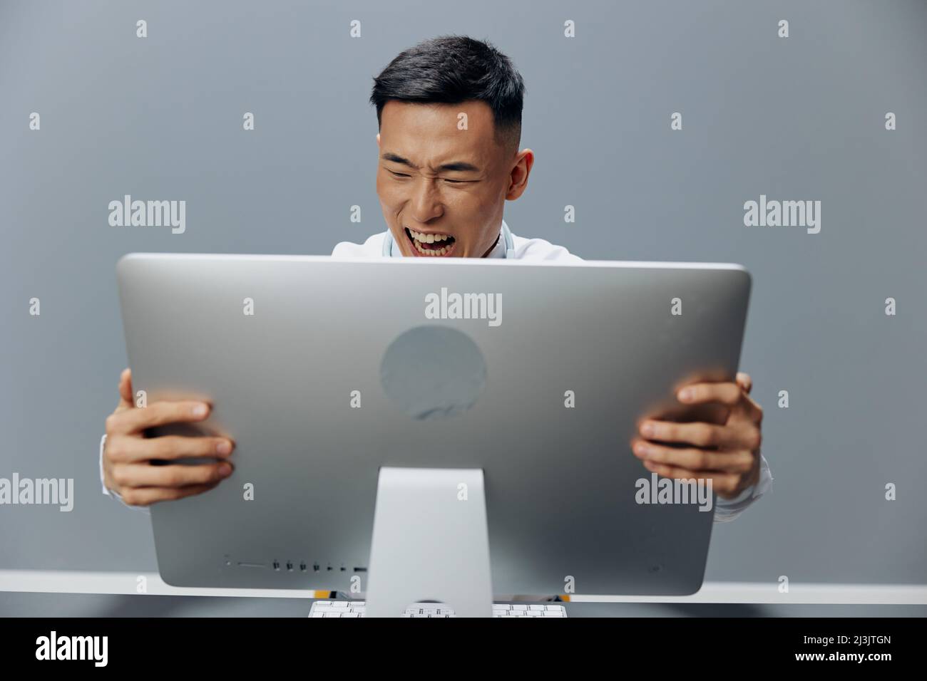 manager holding on to the monitor emotions office Gray background Stock ...