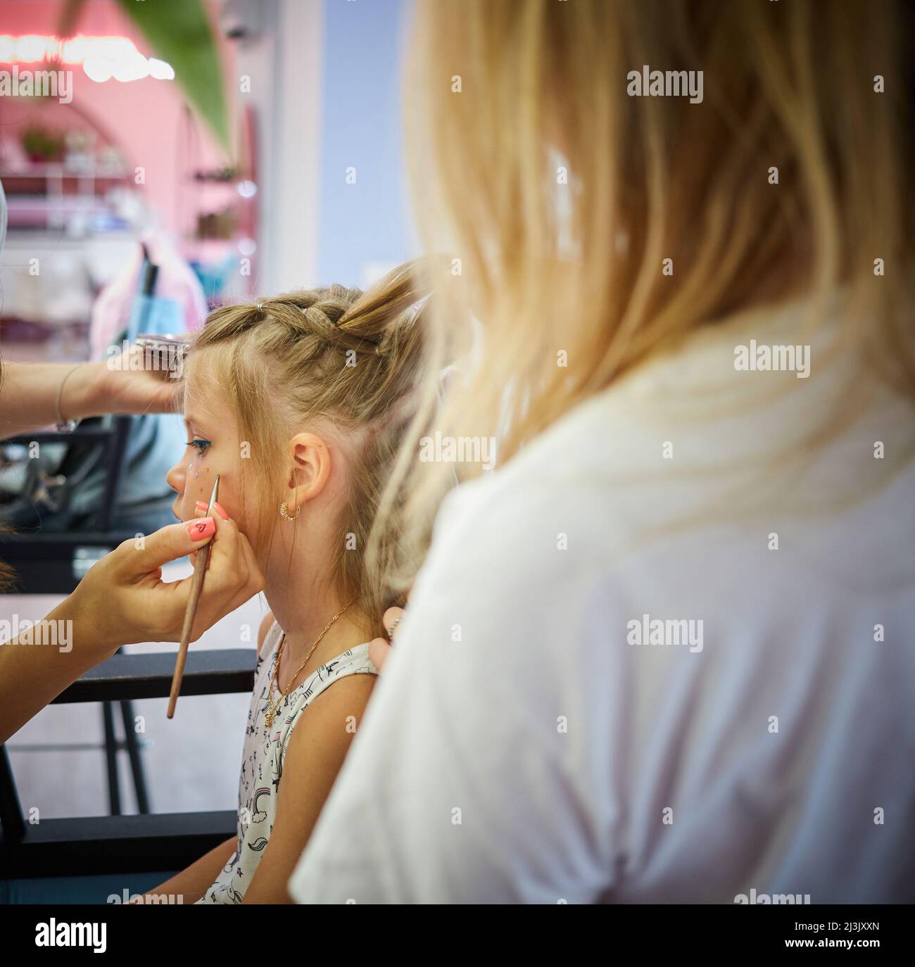 Children make up. Glitter makeup. Sparkles on cheek Stock Photo - Alamy