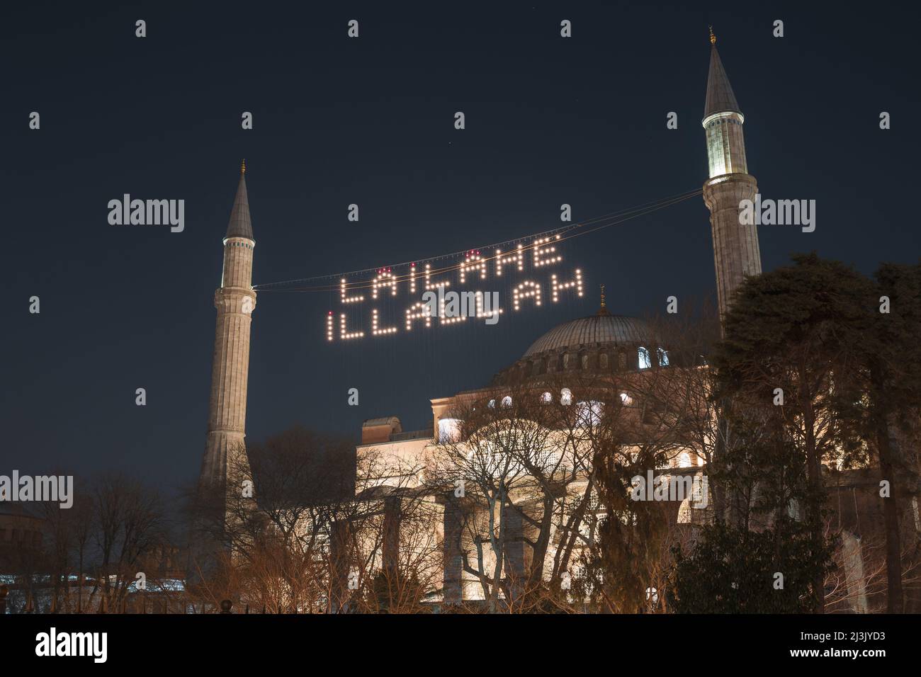Ramadan in Istanbul. Mahya between the minarets of Hagia Sophia or ...