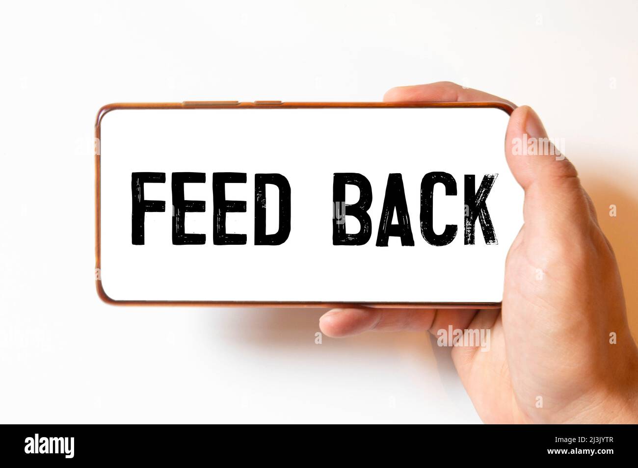 Paper with text feed back for text with background Stock Photo - Alamy