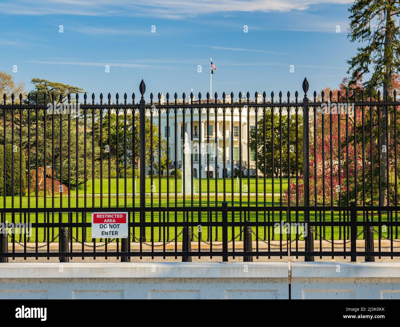 Sunny view of The White House behind fence at Washington DC Stock Photo ...