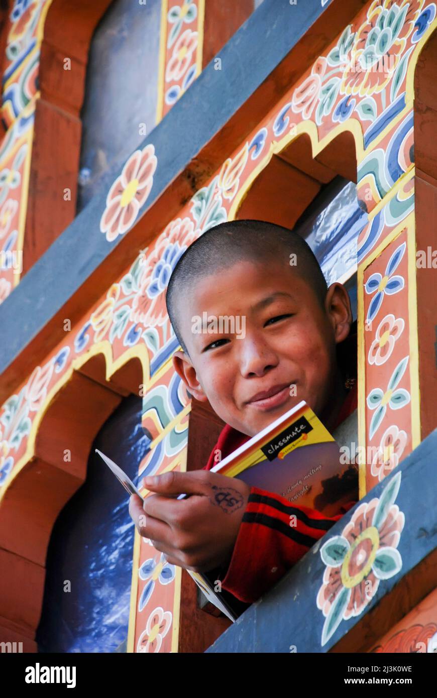 At the Gangteng Gompa Monastery, in Phobjika, Bhutan, a young monk ...