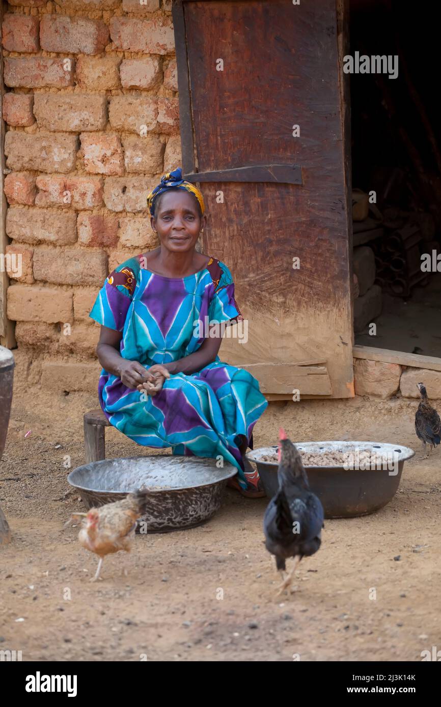 A woman sorts beans in the small village Bulu.; Bulu, Democratic ...