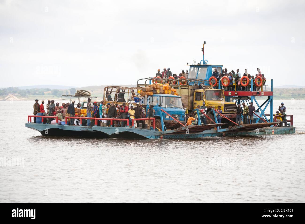 An overloaded ferry crosses the Congo River at Luozi.; Luozi ...