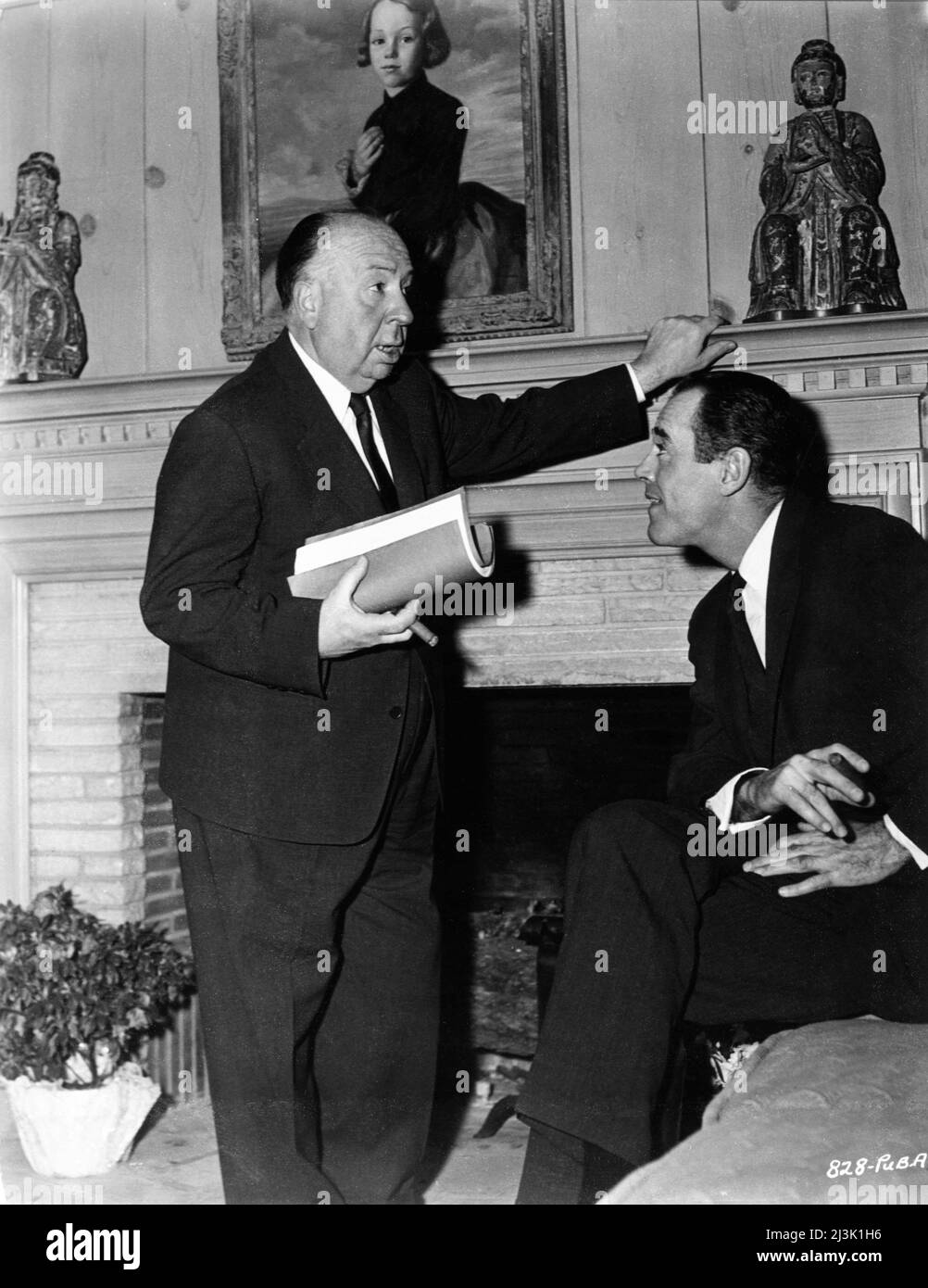 ALFRED HITCHCOCK at his Hollywood Home with HENRY FONDA discussing the ...