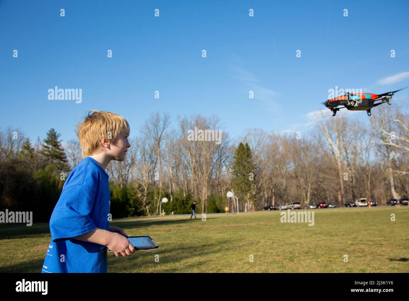 A nine year old boy flies his drone in a local park.; Cabin John ...