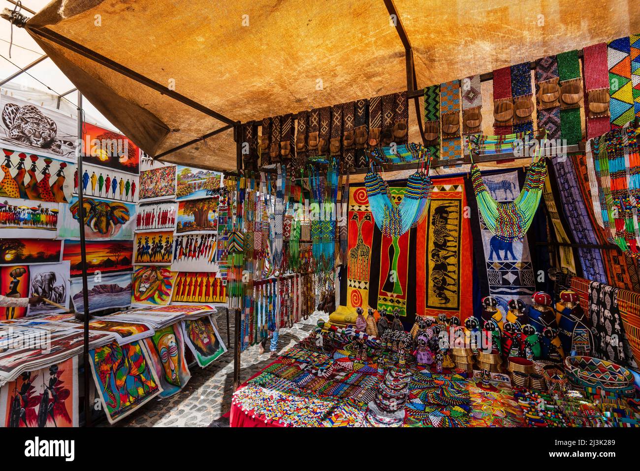 Cultural souvenirs on display in the market stall in Greenmarket Square ...