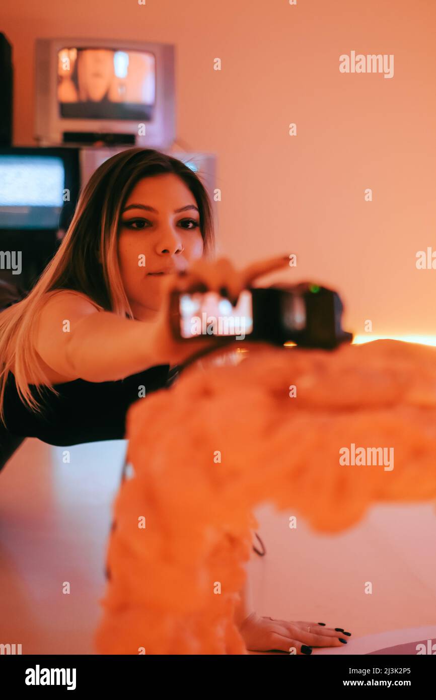 Young caucasian woman dancer making self video with new dance moves on ...