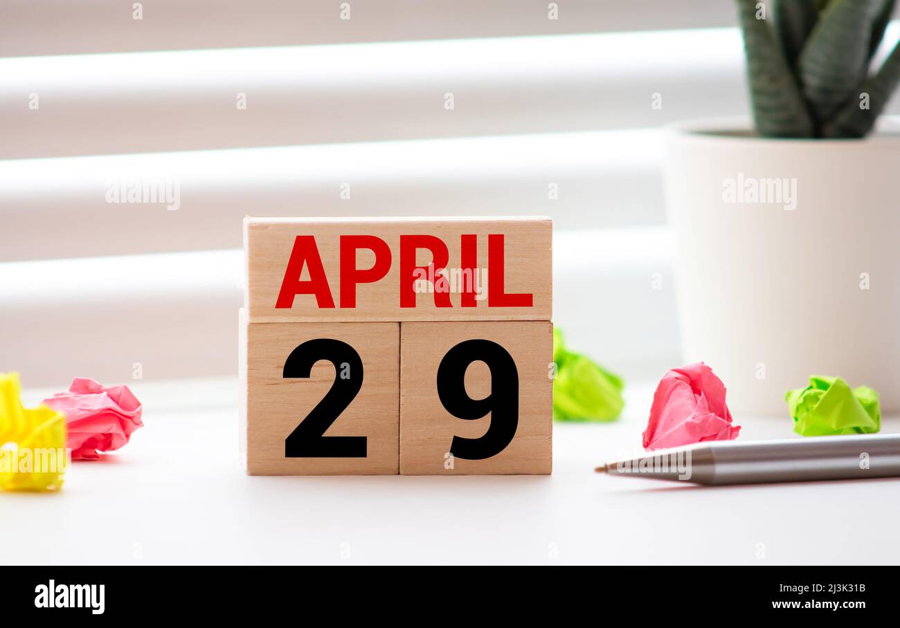 Empty white background with number cube on the table, April 29 Stock ...