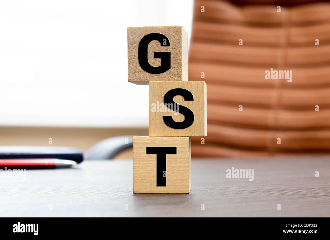 word GST on wooden block Stock Photo - Alamy