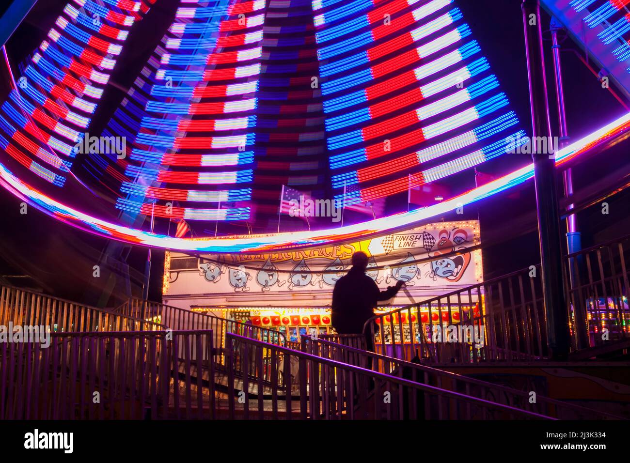 Carnival ride worker hi-res stock photography and images - Alamy