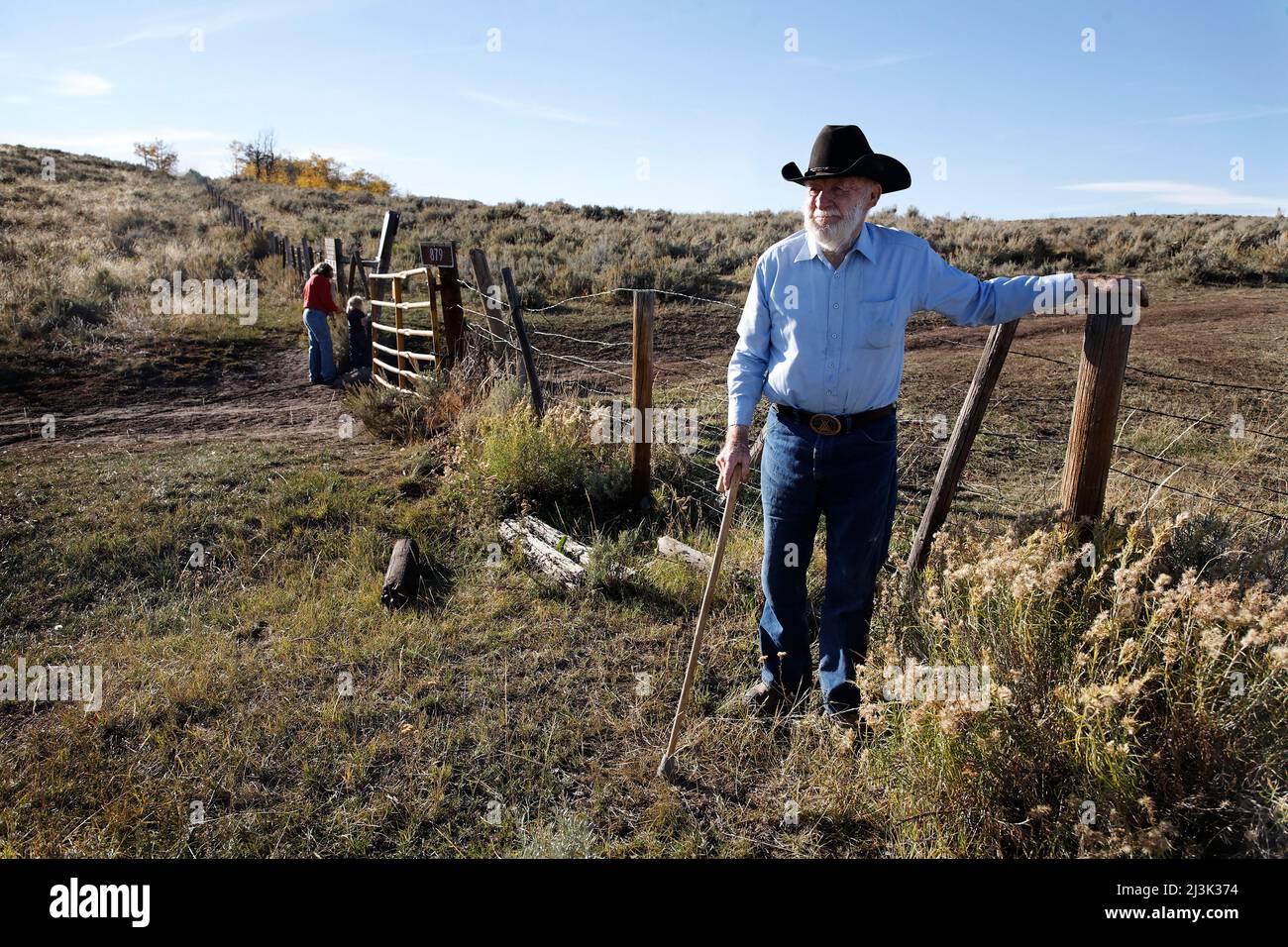 Rancher checking fence at Ladder Livestock Ranch in Wyoming, USA ...