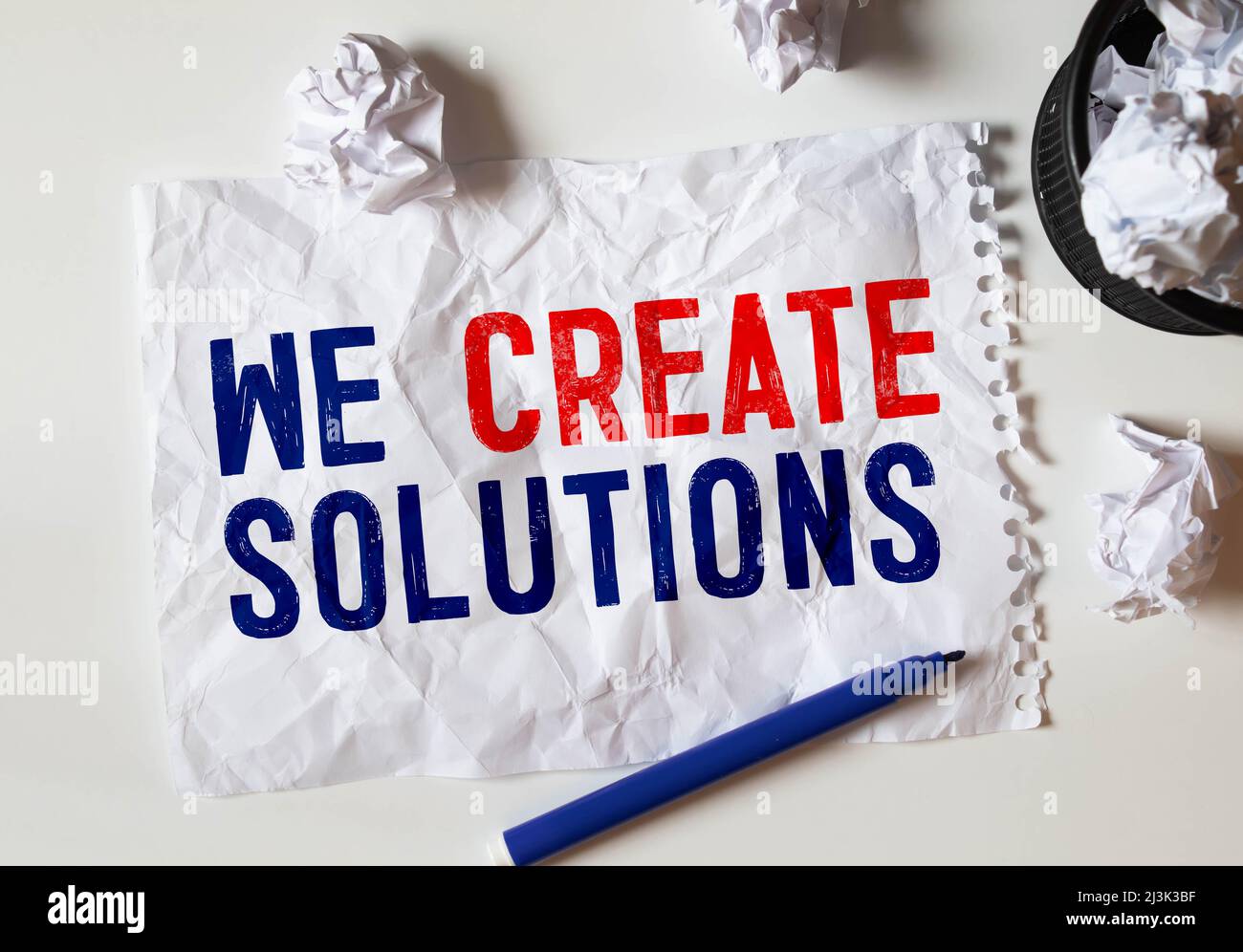 text text We create solutions appearing behind torn brown paper Stock ...