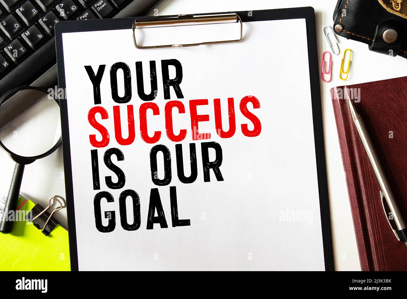 Text your success is our goal on the short note texture background ...