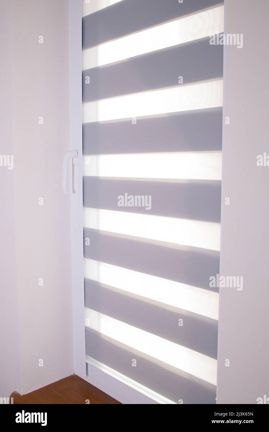 Window roller duo system day and night. Close up on roll curtains ...