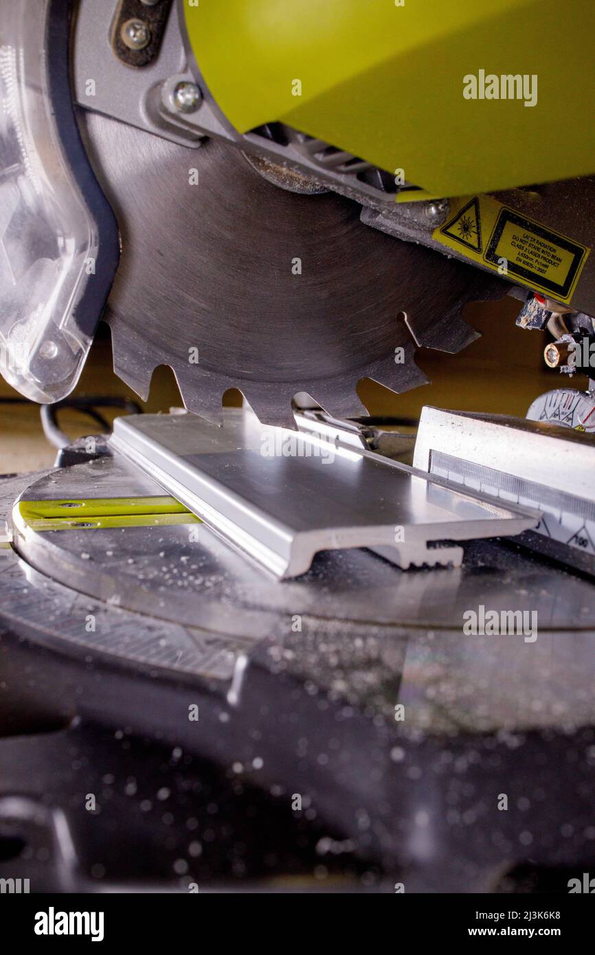 The circular saw cuts the plinth. Tool for repair work Stock Photo - Alamy