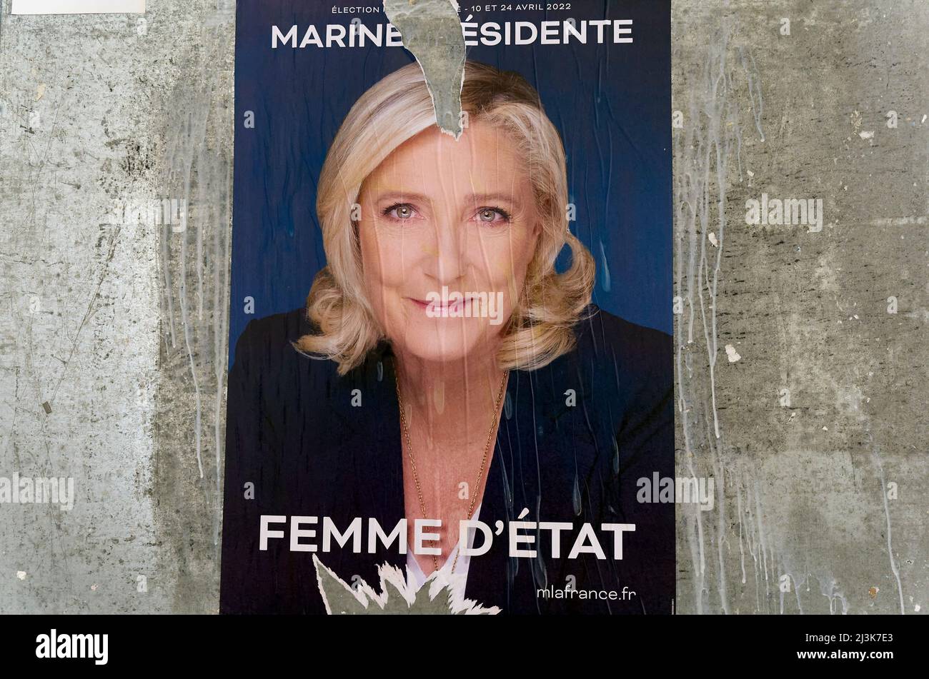 April 4, 2022, Paris, France: A torn electoral campaign poster with ...