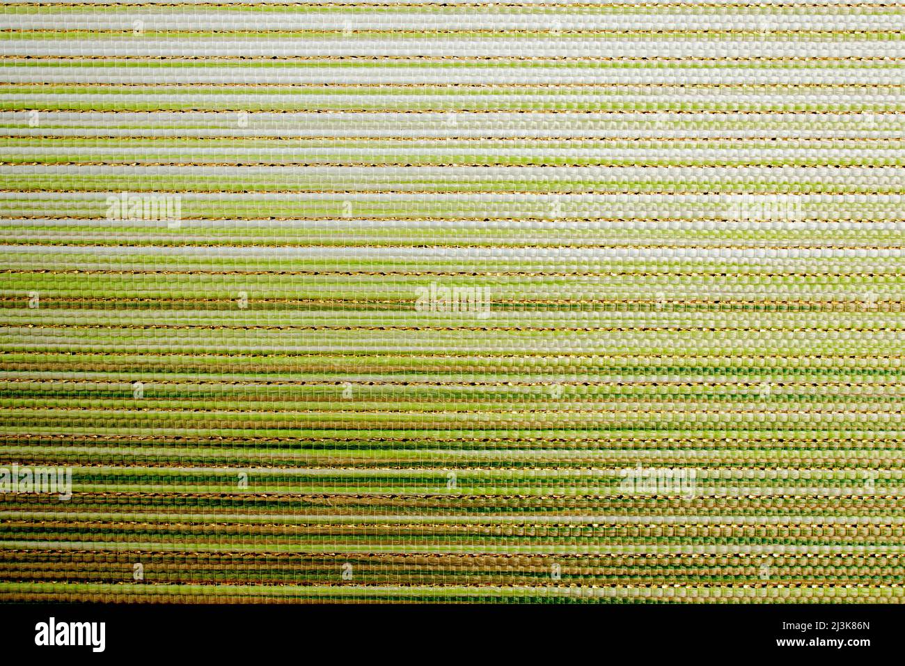 Background from dense dense fabric. Color transition from green to ...