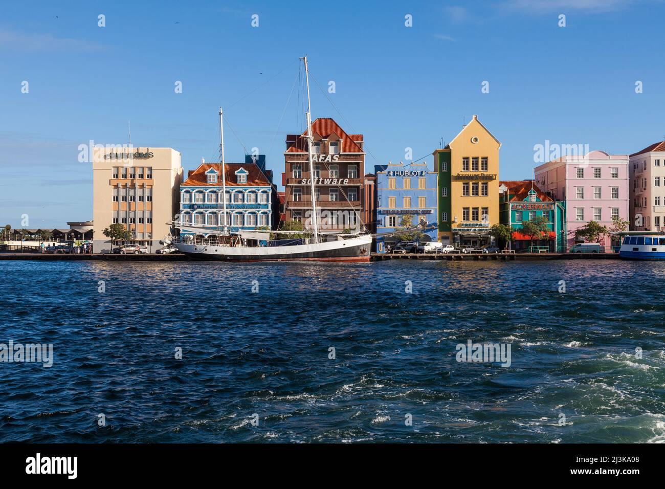 Colorful buildings and sail boat at Willemstad, Curacao Stock Photo - Alamy