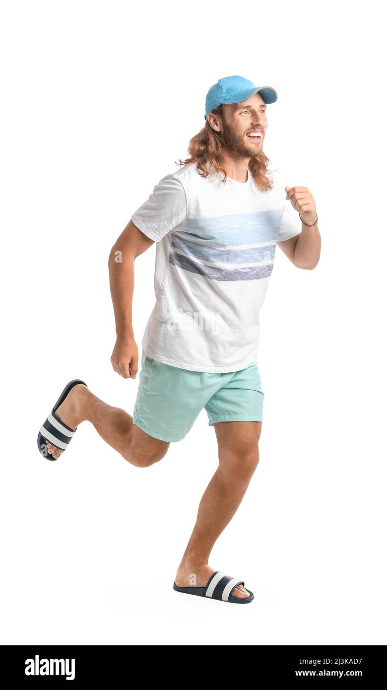 Handsome running guy on white background Stock Photo - Alamy