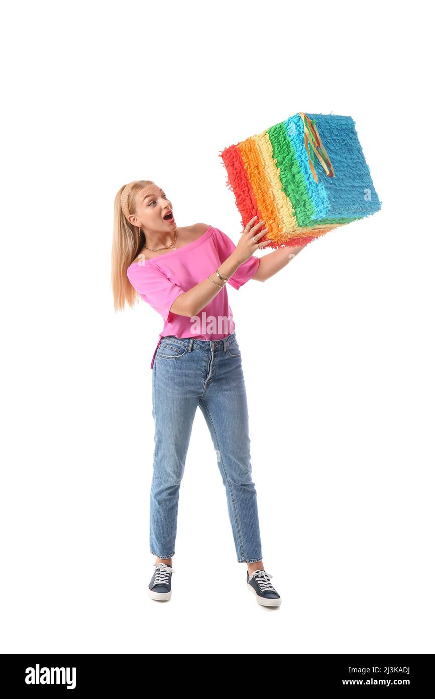 Surprised young woman with Mexican pinata on white background Stock ...