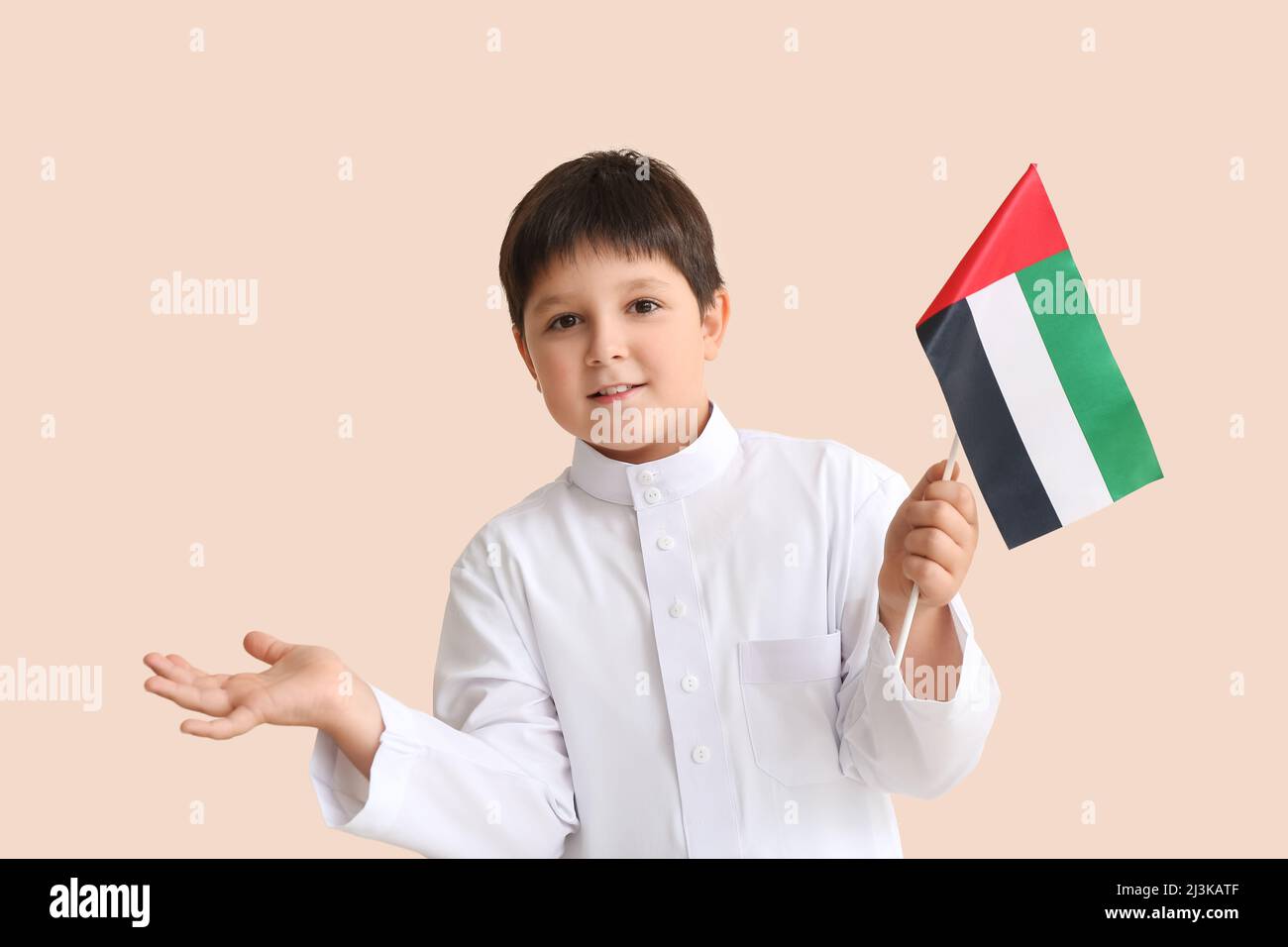 Cute little boy with national flag of UAE on light background Stock ...