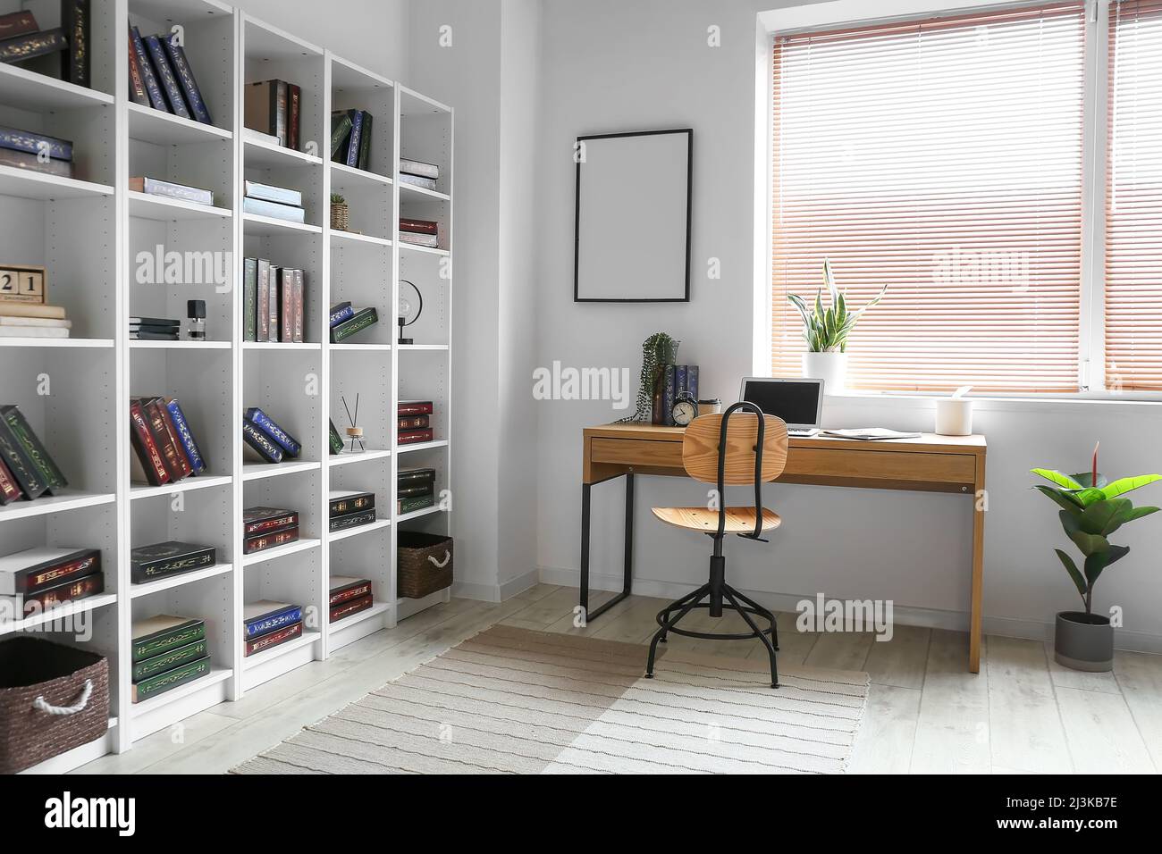 Interior of modern home library with workplace Stock Photo - Alamy