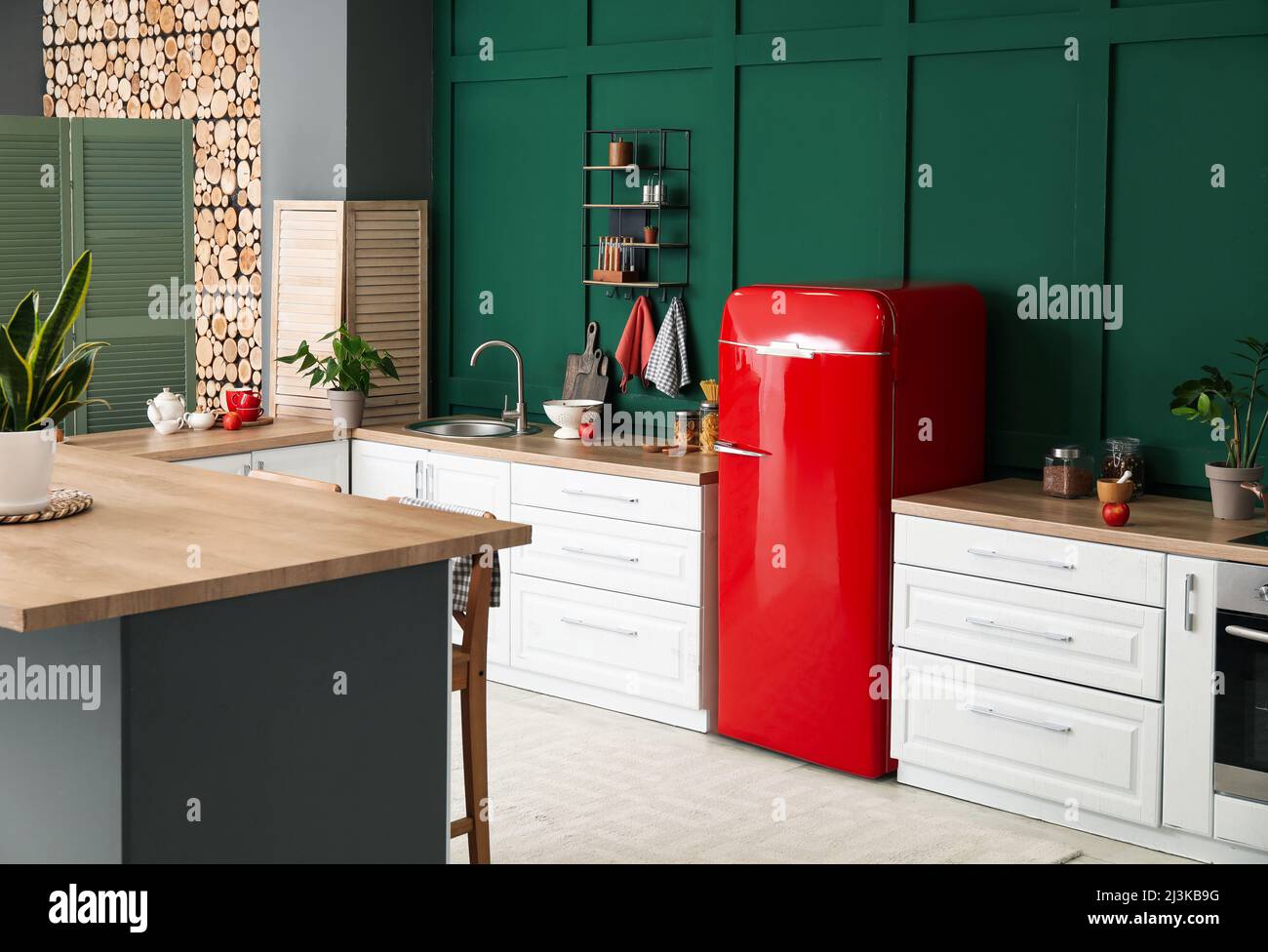 Interior of modern kitchen with stylish refrigerator and counters Stock ...