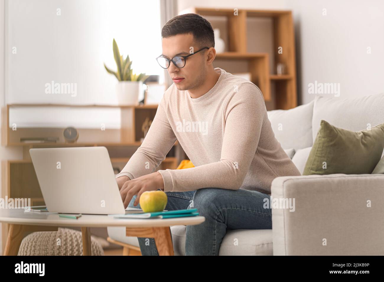 Young boy using apple laptop hi-res stock photography and images - Alamy