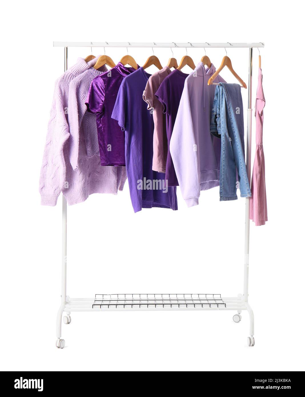 Rack with female clothes on white background Stock Photo - Alamy