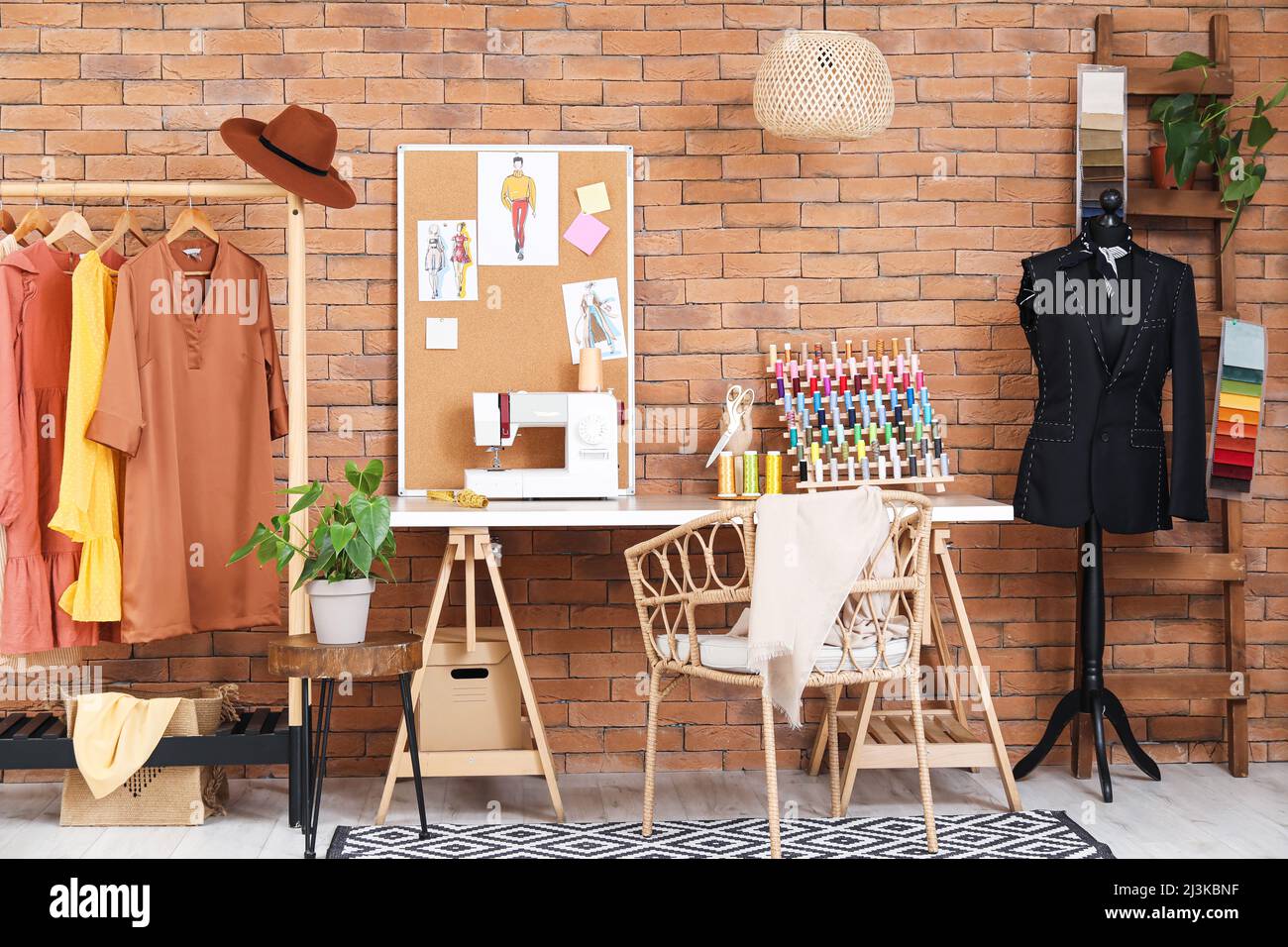 Interior of atelier with tailor's workplace Stock Photo - Alamy