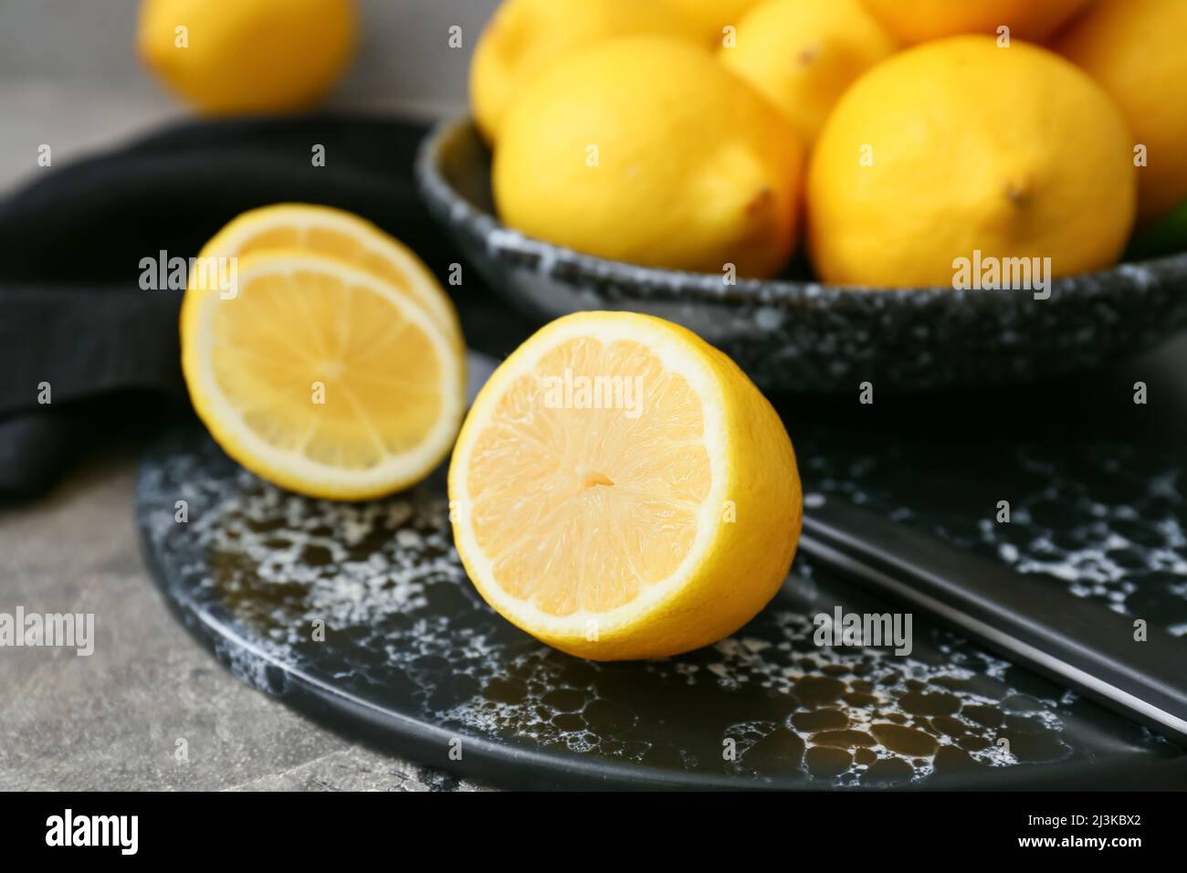 Fresh cut lemon on grey table, closeup Stock Photo - Alamy