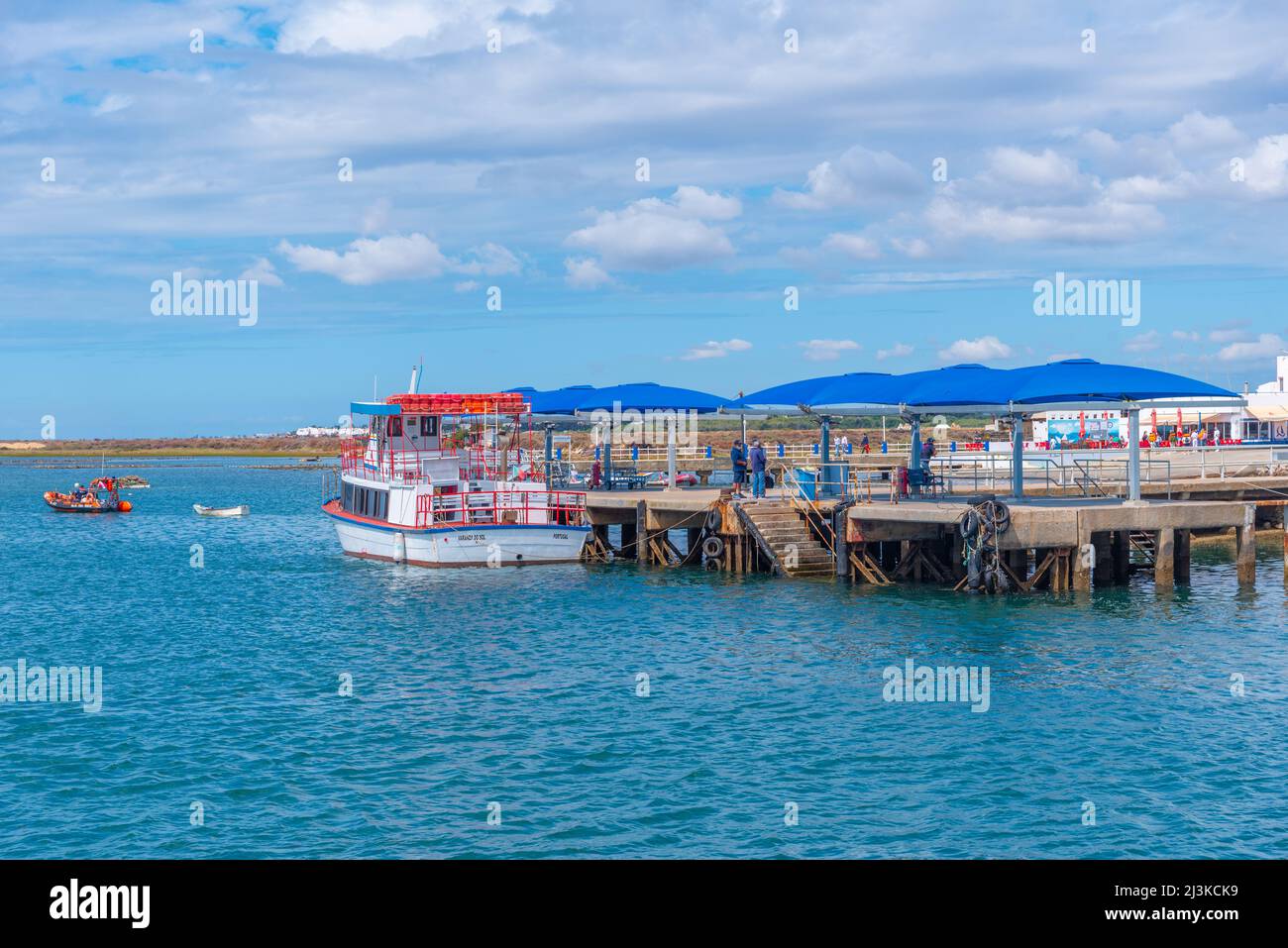 Tavira, Portugal, June 18, 2021: Tourist ferry bringing people to Ilha ...
