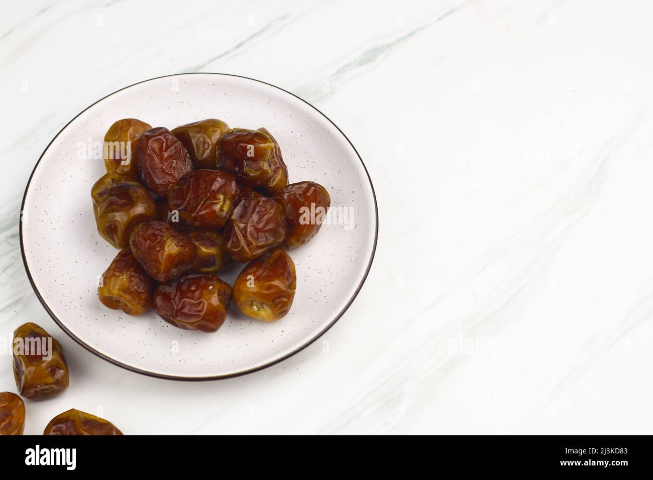 Kurma Sukkari or Sukkari Dates on marble white background. Breakfasting ...