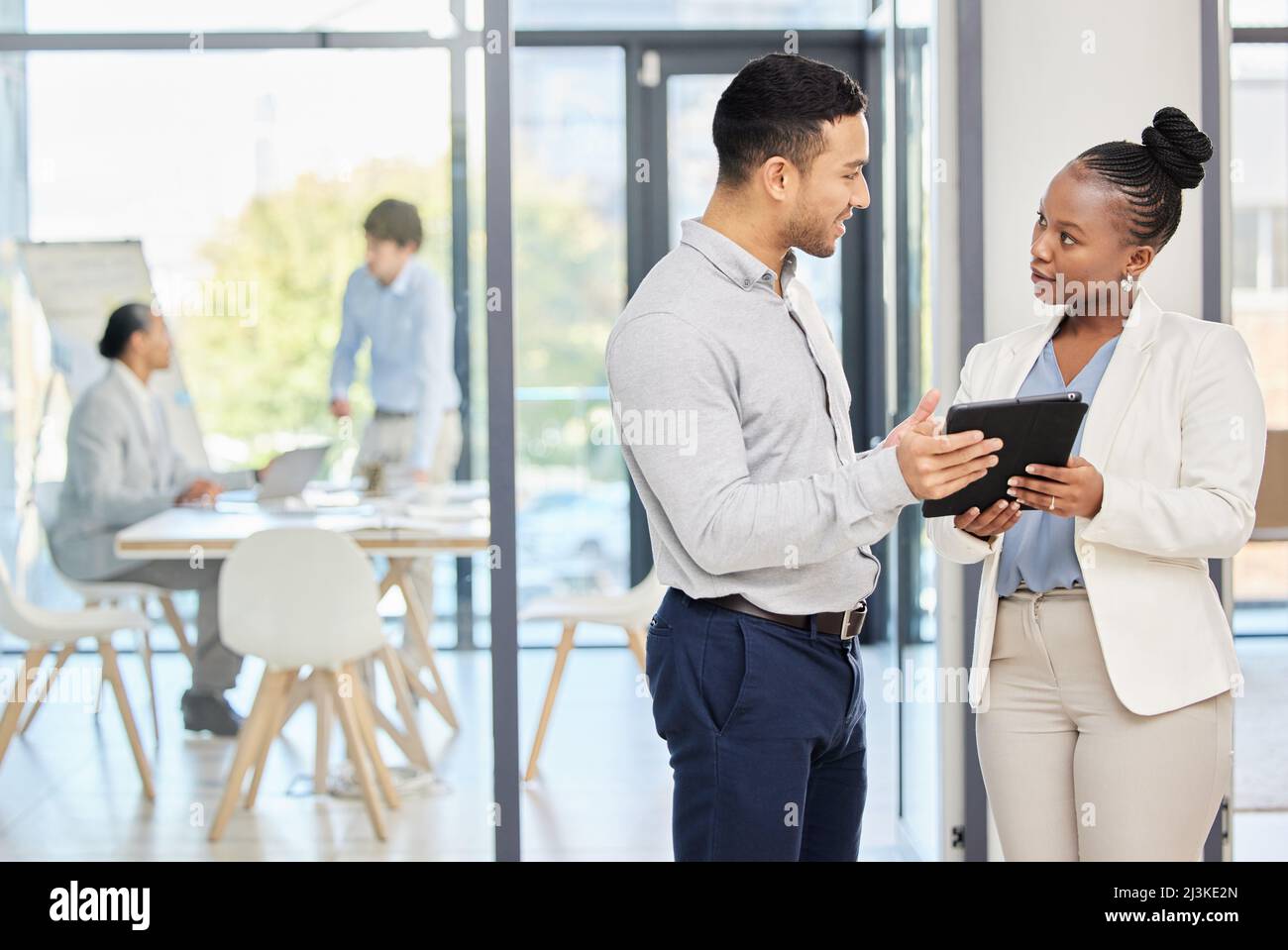 Our team project is on point. Shot of two professional coworkers using ...