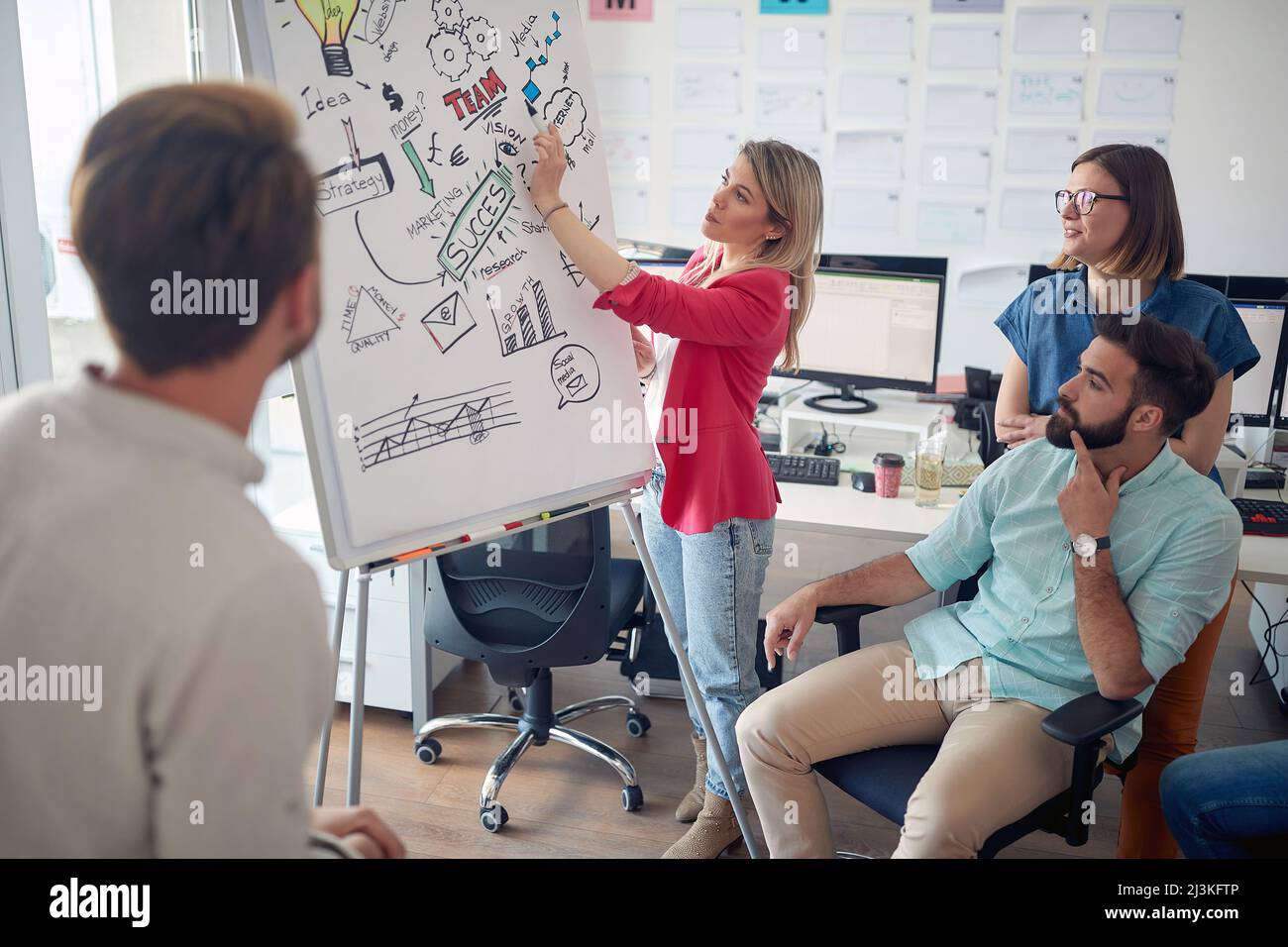 Group of diverse ambitious employees brainstorming together in the ...