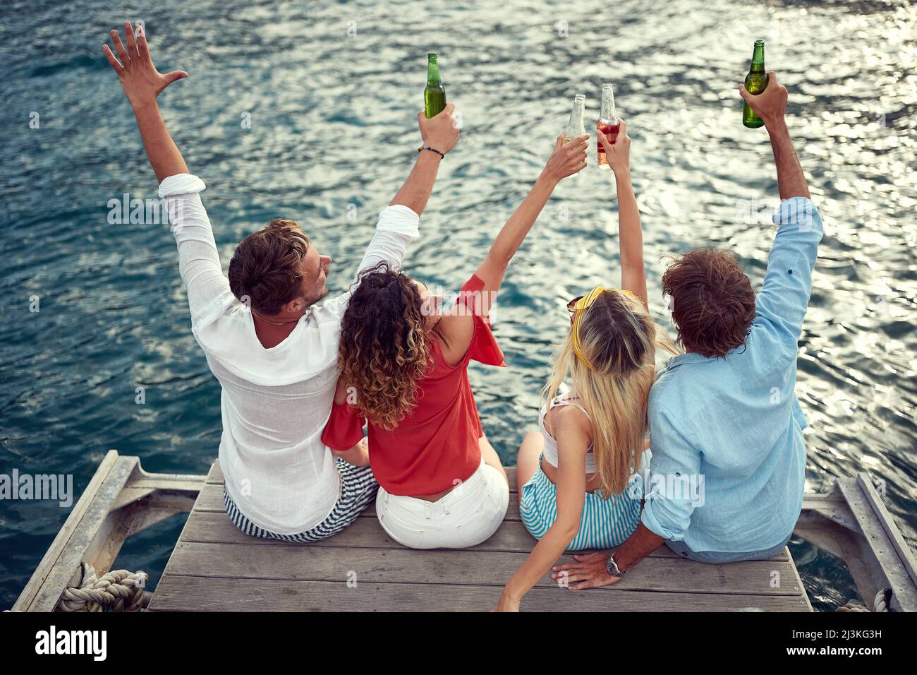 Family sitting lake legs in water hi-res stock photography and images ...
