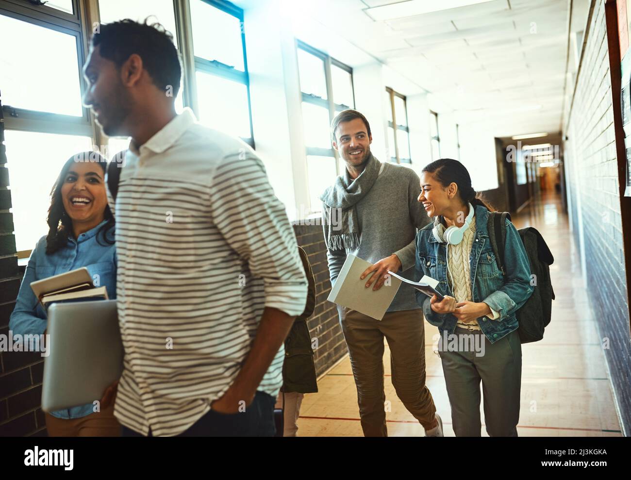 University life. Cropped shot of a group of university students walking ...