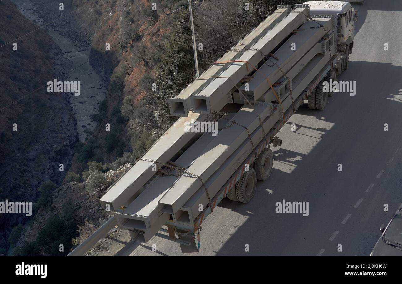 Long trailer loaded with steel bridge components Stock Photo - Alamy