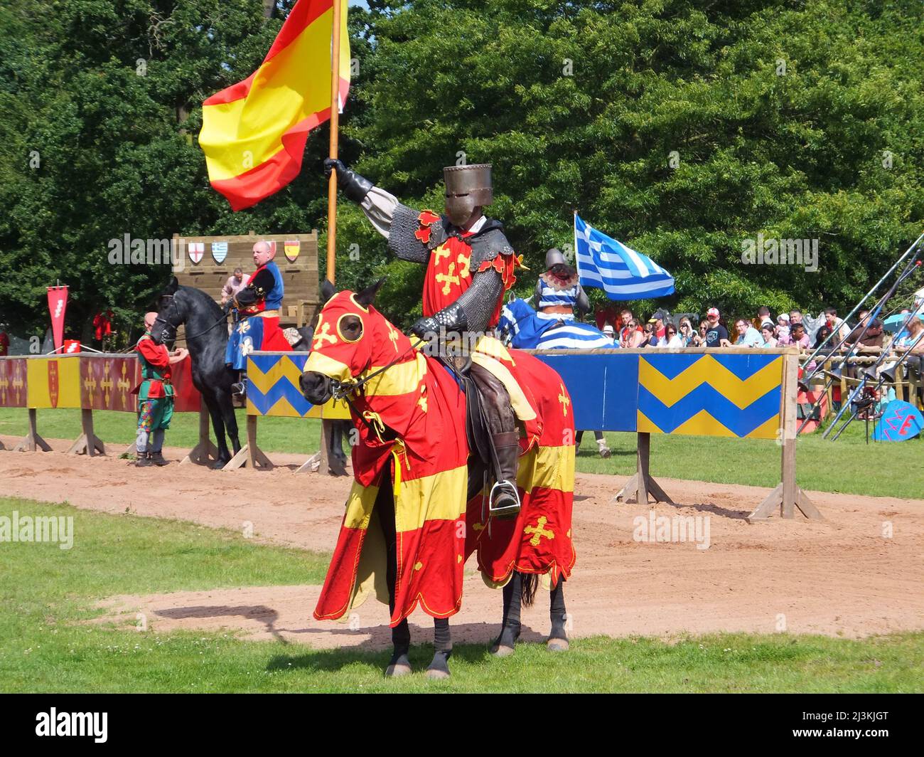 A knight on horseback raises his flag in victory at Warwick Castile in ...
