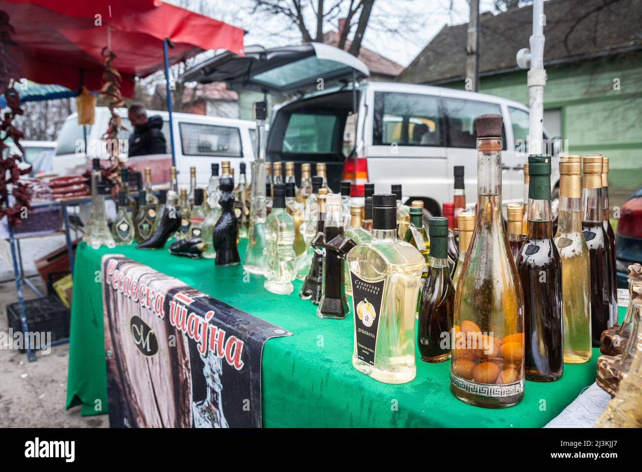 Picture of various rakijas displayed In Kacarevo, in a market, in ...