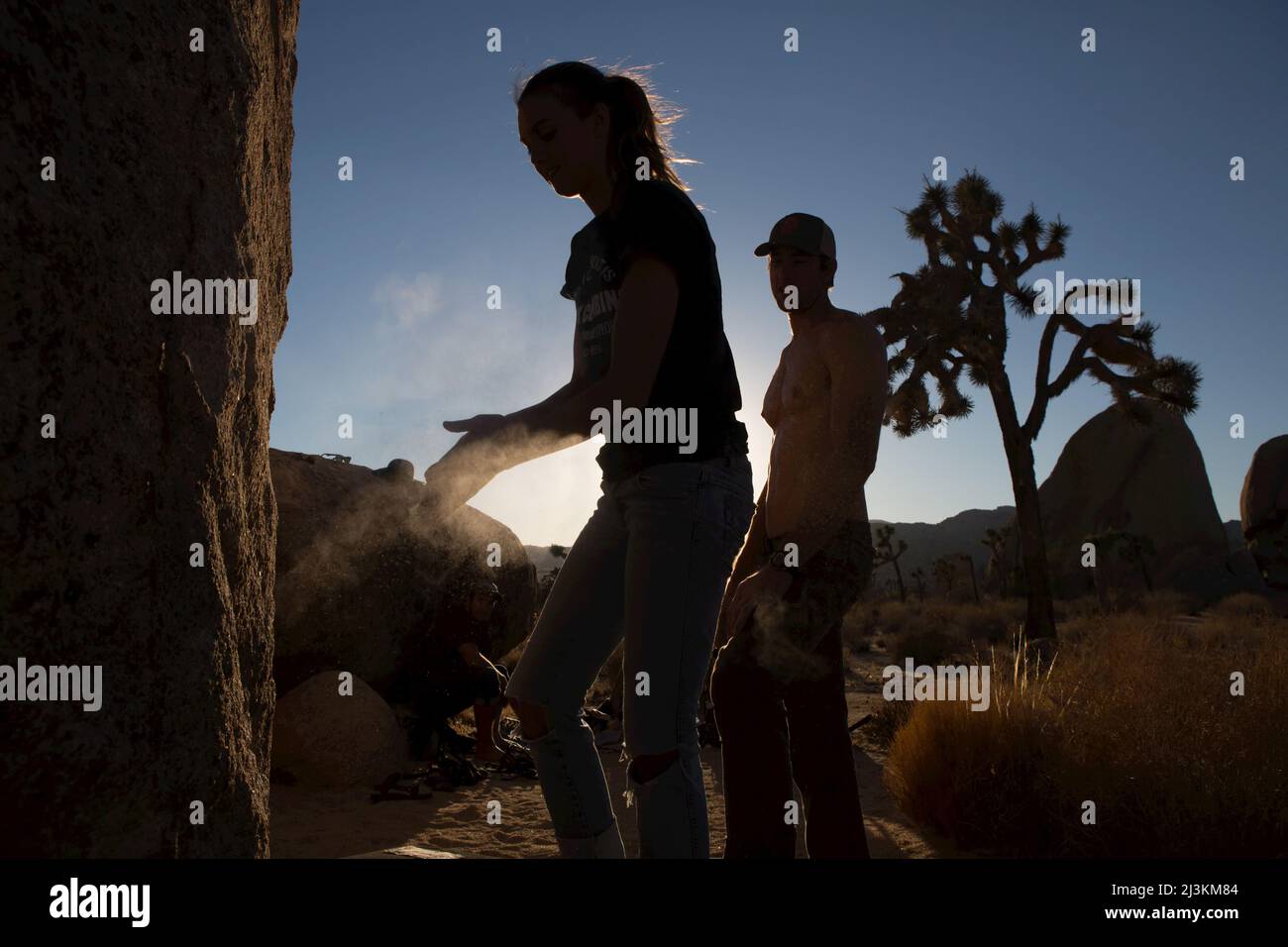 A climber chalks her hands in preparation to climb the Classic Curl ...