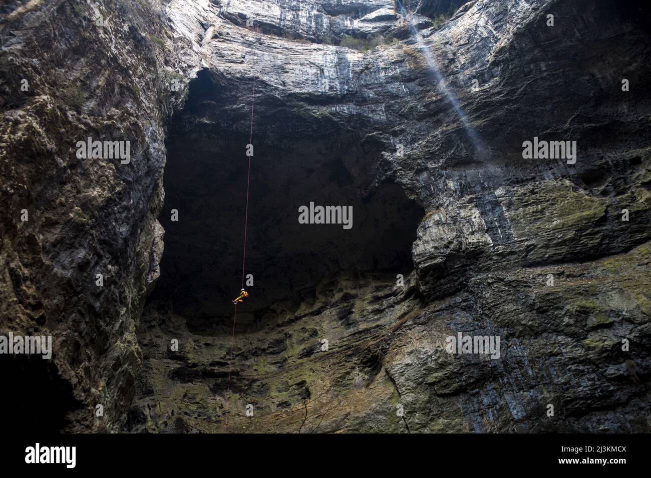 A woman rappels into a 600 foot deep sinkhole in China Stock Photo - Alamy