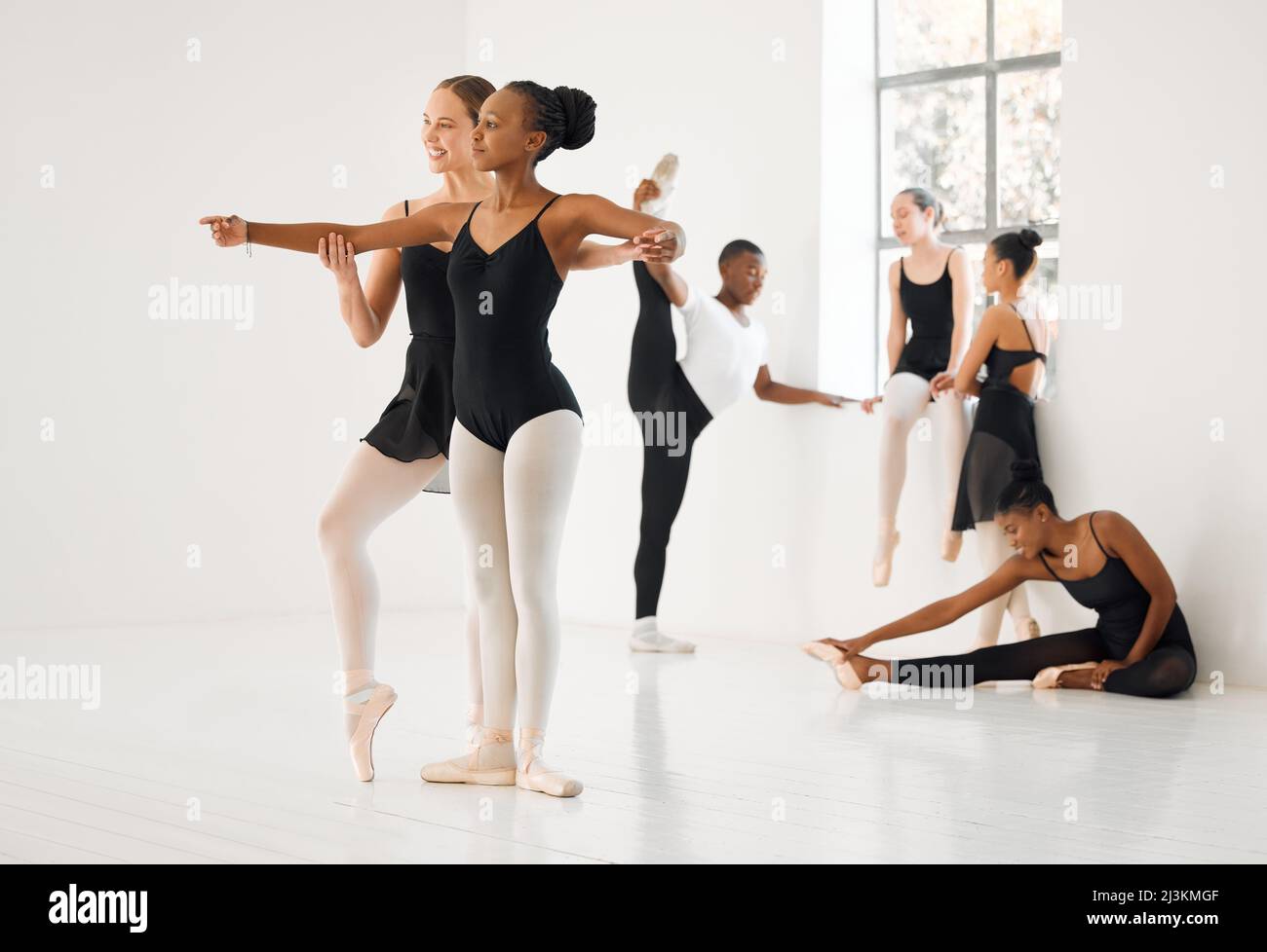 They danced by the glimmer of the lights. Shot of a group of ballet ...