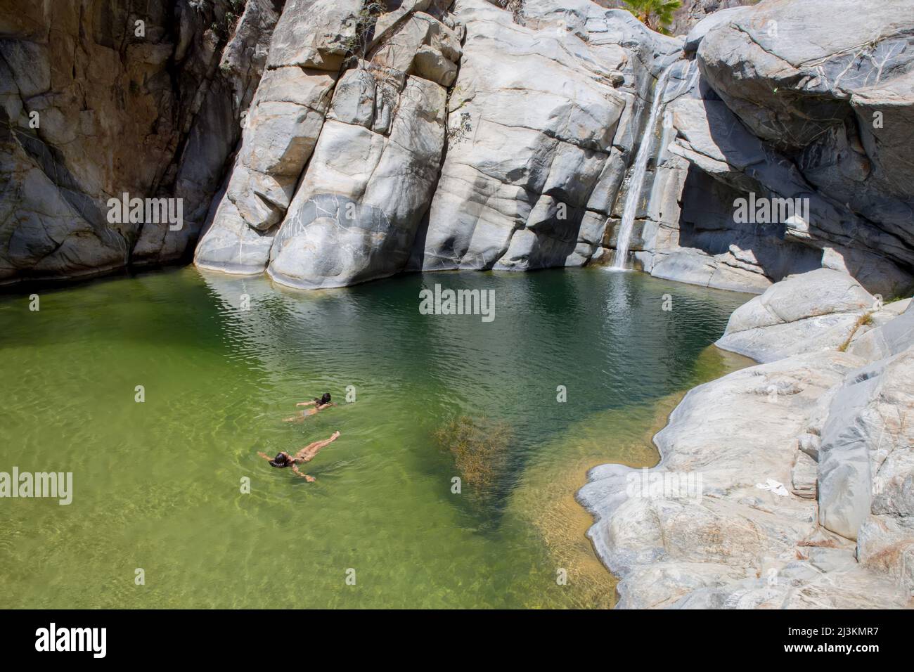 Two women enjoy an Oasis in Southern Baja Stock Photo - Alamy